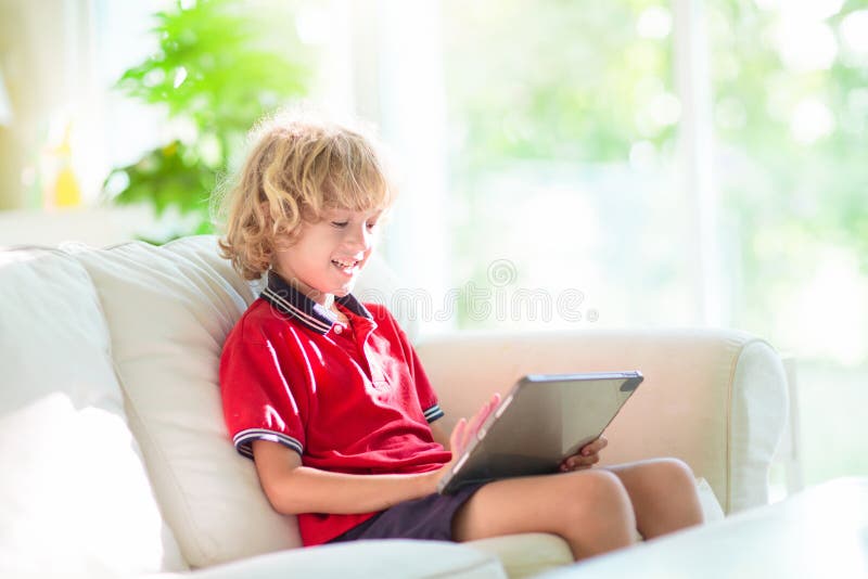 Kids with tablet computer stock photo. Image of home - 275628788