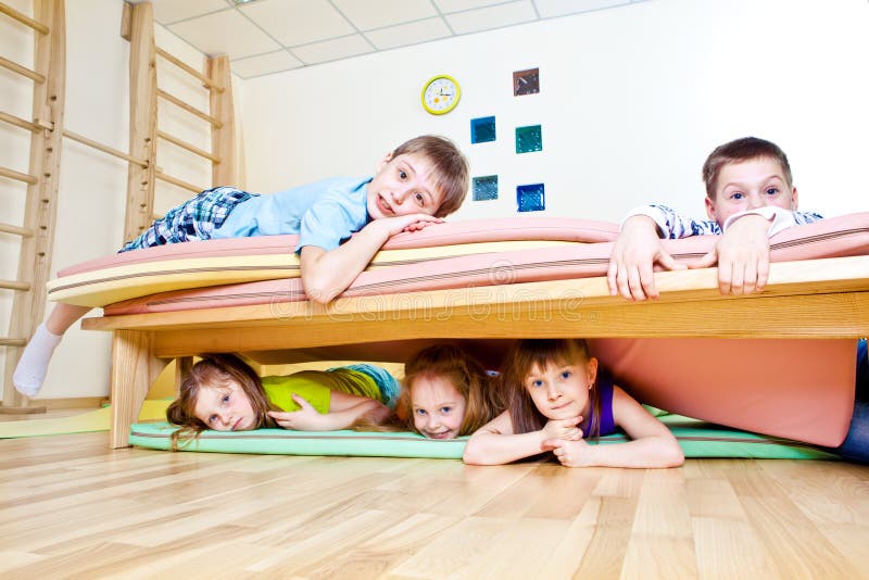 Kids on tumbling mats stock photo. Image of portrait - 24490824