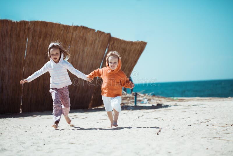 1,601 Kids Holding Hands Beach Stock Photos - Free & Royalty-Free Stock ...