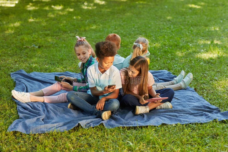 Kids Using Computer Devices in Park Stock Image - Image of friend ...