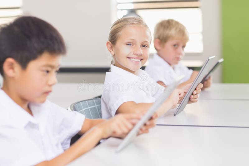 Kids Using Digital Tablet in Classroom Stock Photo - Image of camera ...