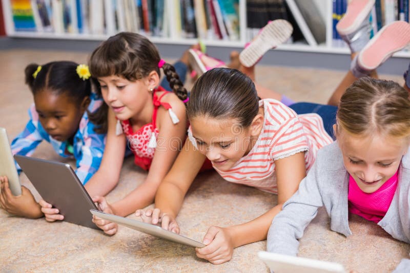 Kids Using Digital Tablet in Library Stock Photo - Image of elementary ...