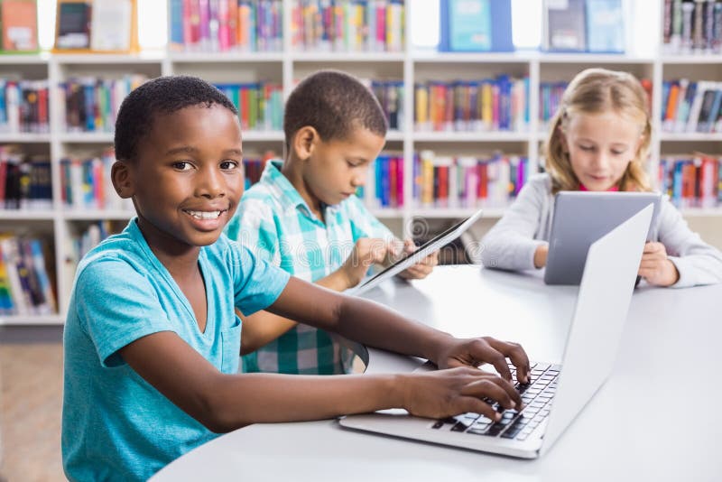 Kids Using Laptop in Library Stock Photo - Image of academic ...