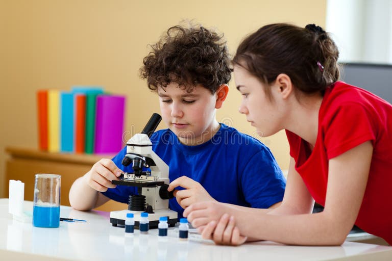 Kids using microscope stock image. Image of biology, close - 19821061