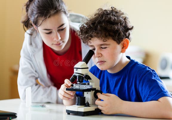 Kids using microscope stock image. Image of chemistry - 36653047