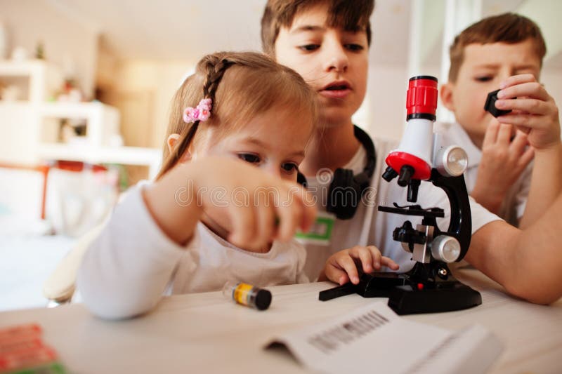 Kids Using Microscope Learning Science Class at Home Stock Photo ...