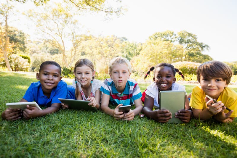 Kids Using Technology during a Sunny Day Stock Photo - Image of five ...