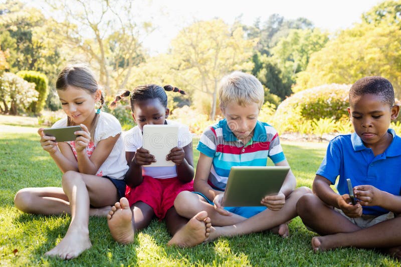 Kids Using Technology during a Sunny Day Stock Image - Image of leisure ...
