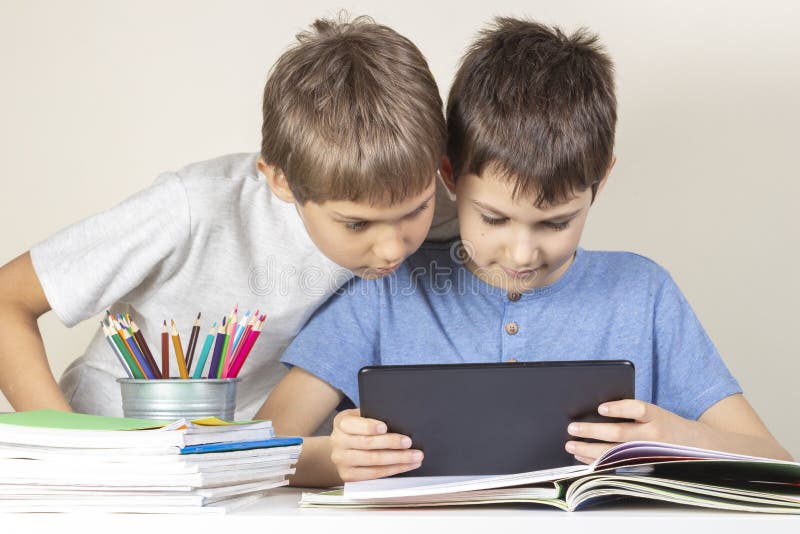 Kids Using Together Tablet Computer at Home Stock Image - Image of book ...