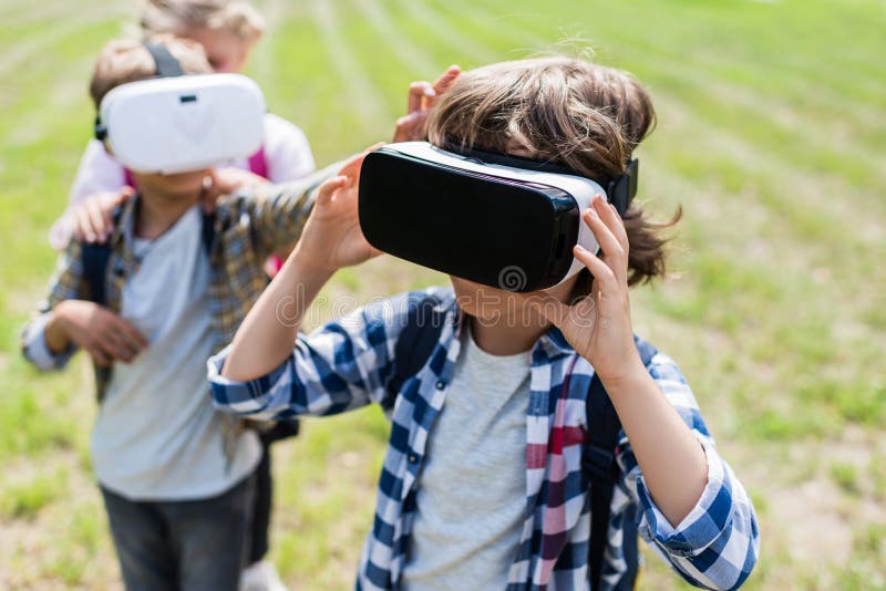 Kids using vr headsets stock photo. Image of together - 103918296