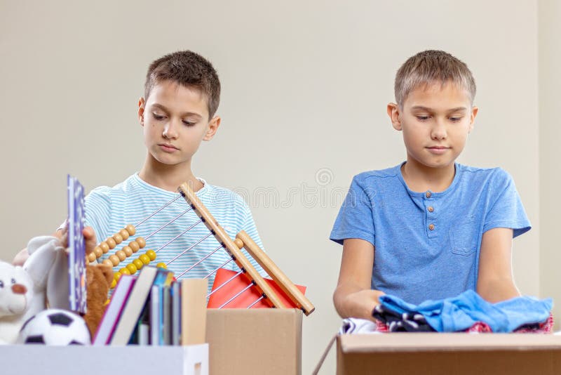Kids Volunteers Sorting Toys, Clothes, Books, Donation Goods in Donate ... Kids Volunteers Sorting Toys, Clothes, Books, Donation Goods in Donate ...