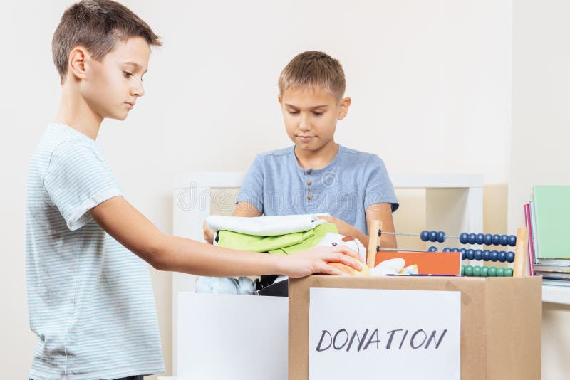 Kids Volunteers Sorting Toys, Clothes, Books, Donation Goods in Donate ... Kids Volunteers Sorting Toys, Clothes, Books, Donation Goods in Donate ...
