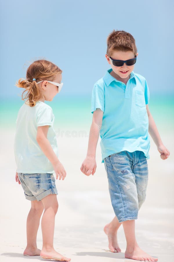 Two Kids Walking Along a Beach at Caribbean Stock Image - Image of ...