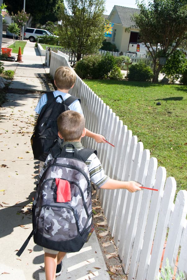 Kids Walking Home from School Stock Photo - Image of fence ...