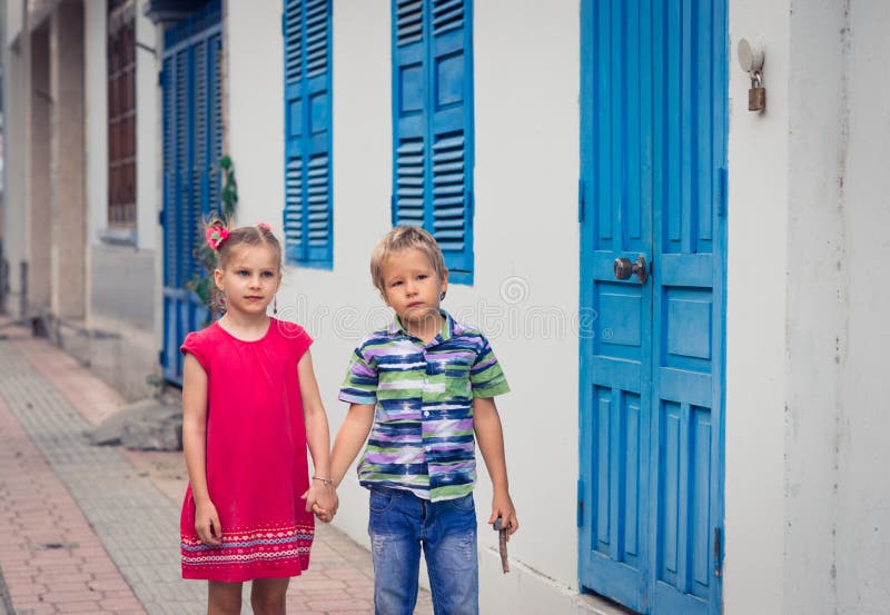 Kids walking by the street stock photo. Image of kids - 176017548