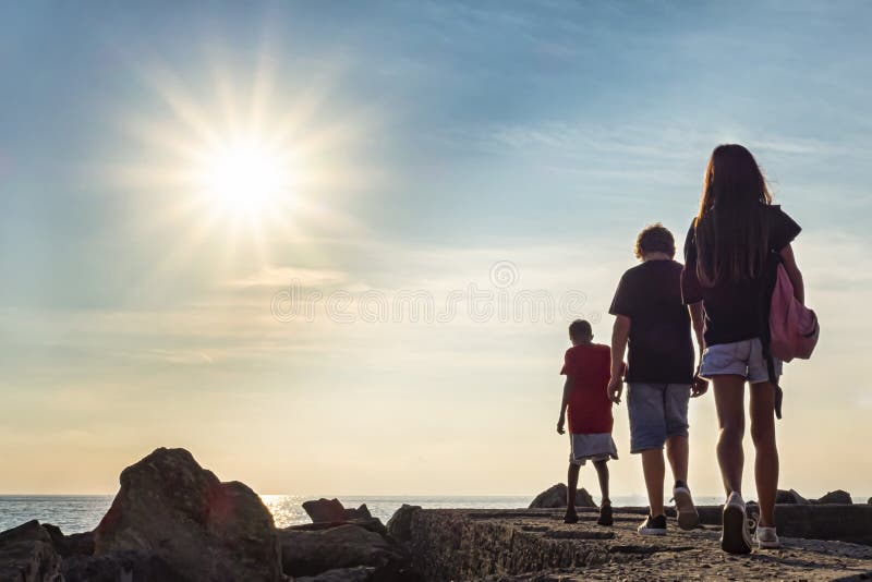 Kids Walking at Sunset on the Seaside Stock Image - Image of beautiful ...