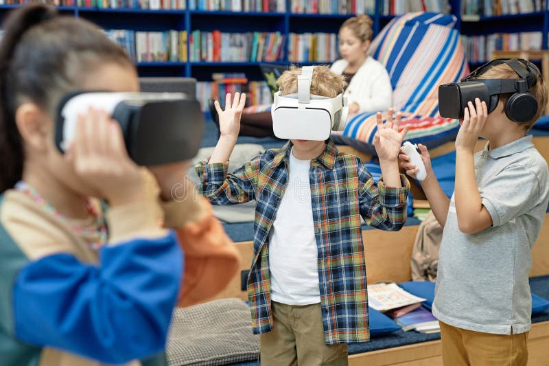 Kids Wearing VR Headsets in Library Stock Photo - Image of education ...