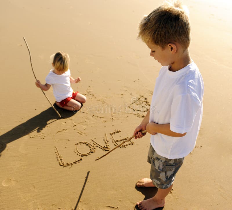 Kids writing in sand stock photo. Image of child, happy - 15822922