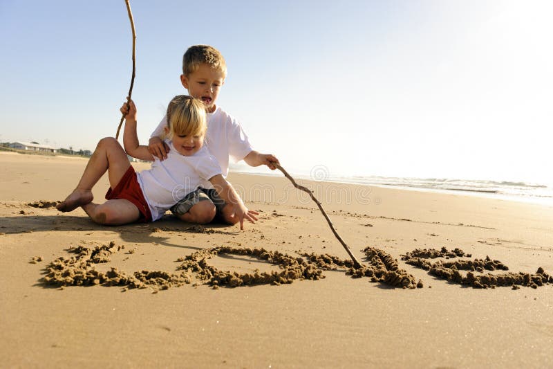 Kids Writing In Sand Picture. Image: 15822932
