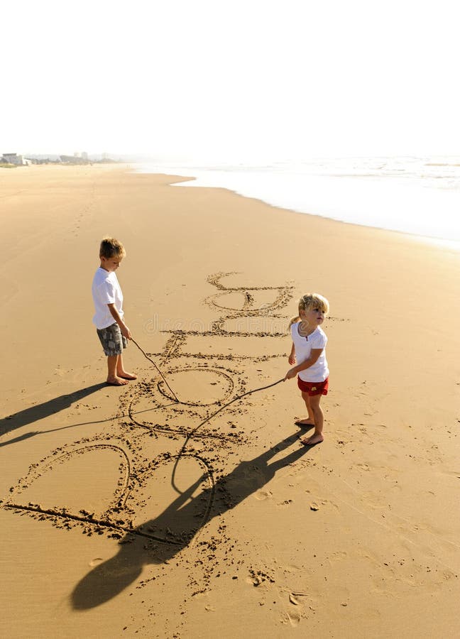 Kids writing in sand stock image. Image of cute, sand - 15822941