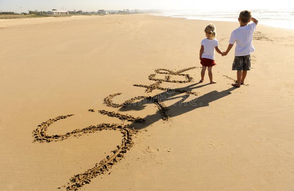 Kids writing in sand stock image. Image of sister, sand - 15822945
