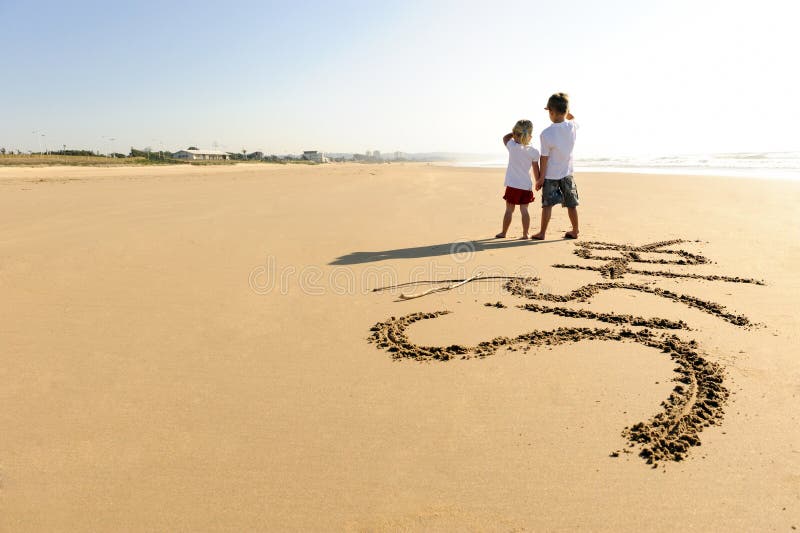 Kids writing in sand stock photo. Image of holiday, coast - 15822948