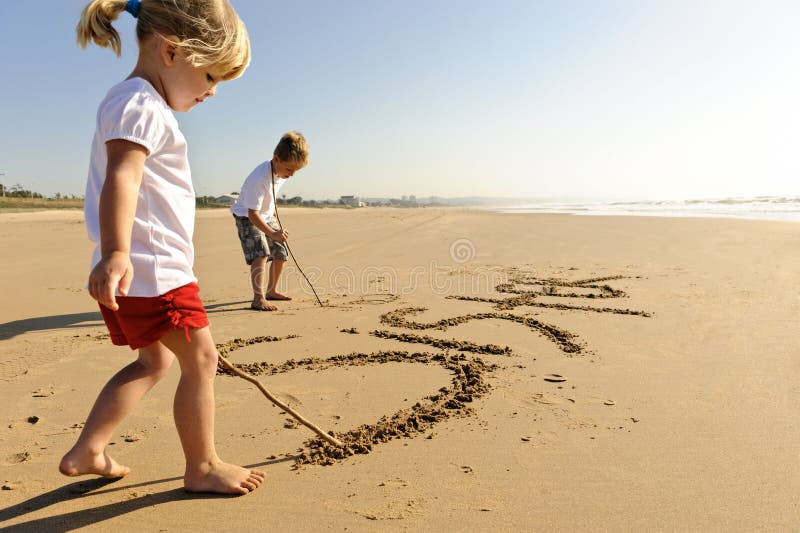 Kids Writing In Sand Picture. Image: 15822954