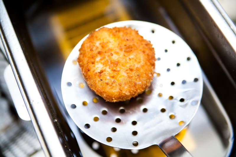Kiev Chicken on Perforated Spoon Stock Photo - Image of fried ...