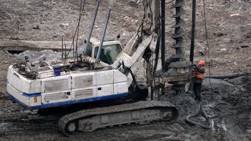 Drilling Rig Boring the Ground Pours a Hole in the Concrete for the ...