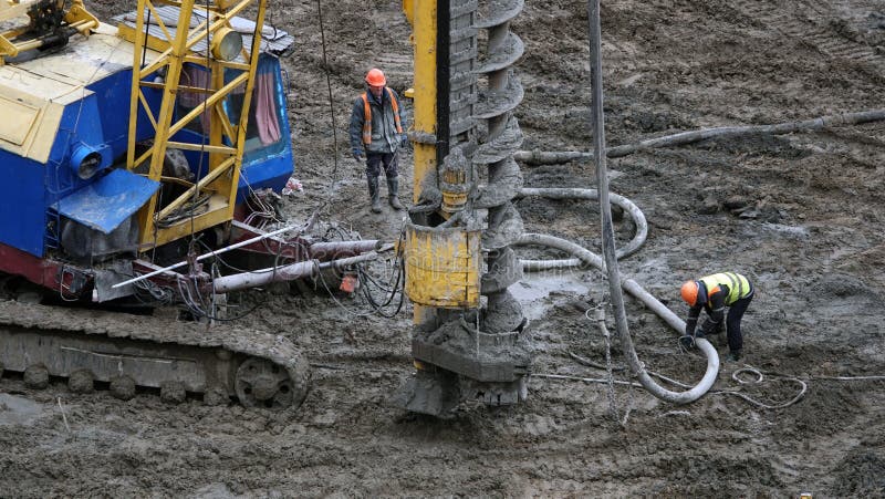 Drilling Rig Boring the Ground Pours a Hole in the Concrete for the ...