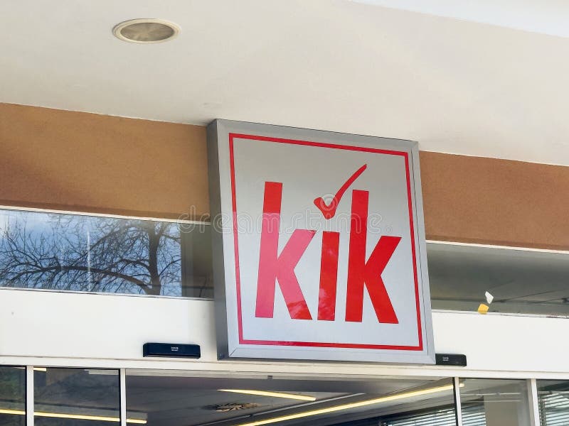 Kik Storefront Signage with Reflective Surface and Red Branding ...