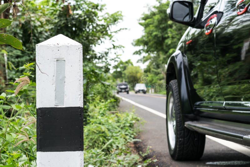 A Kilometer Stone on the Country Road with the Car Background. Stock ...