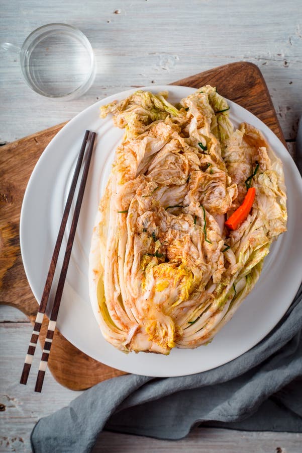Kimchi in the Plate on the White Wooden Table Vertical Stock Image ...