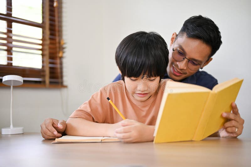 Kind Asian Dad Teaching and Helping His Son To Do Homework, Studying ...