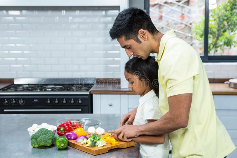 Kind Father Helping His Daughter Slicing Vegetables Stock Image - Image ...