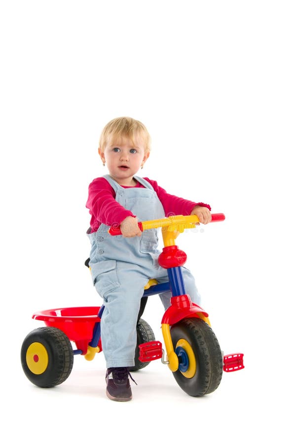 Kind op driewieler stock foto. Image of leren, levensstijl - 18587410