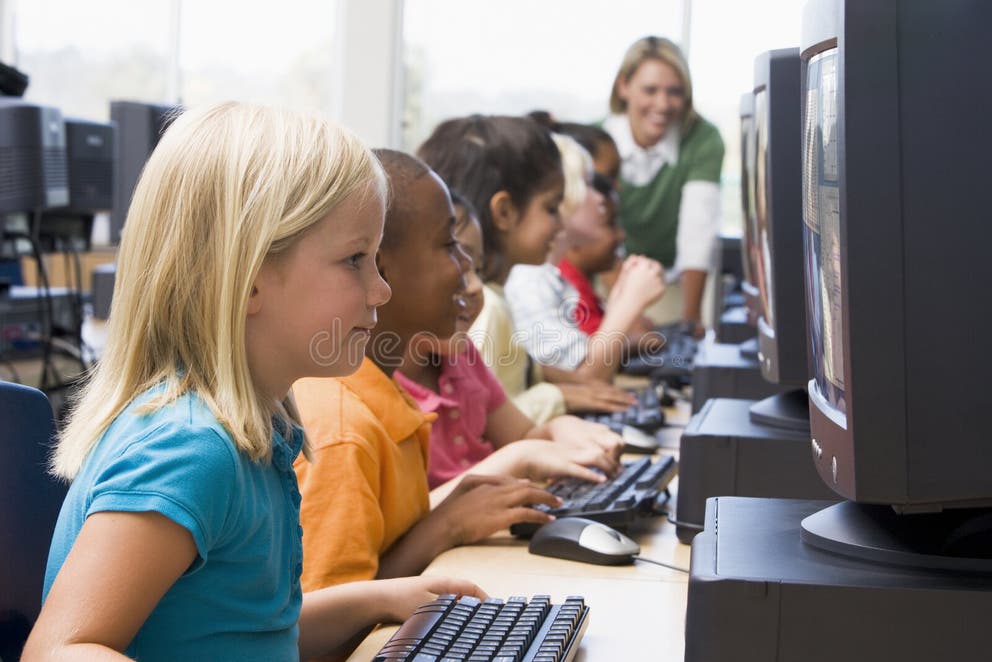Kindergarten Children Learning To Use Computers Stock Photo - Image of ...
