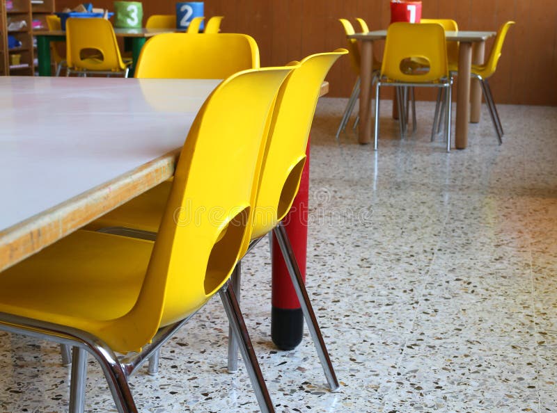 Kindergarten Classroom With Tables And Yellow Chairs Stock Photo ...