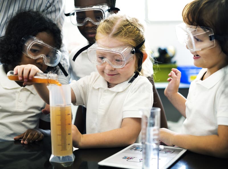 Kindergarten Students Mixing Solution in Science Experiment Laboratory ...