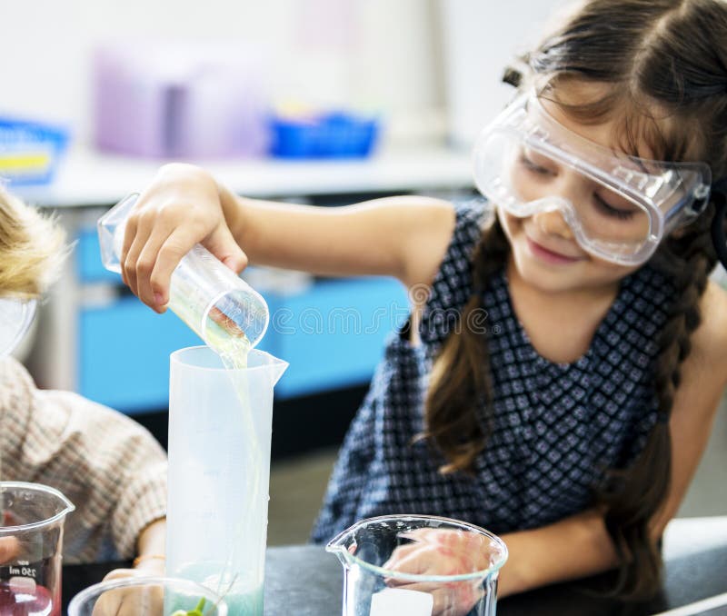 Kindergarten Students Mixing Solution in Science Experiment Laboratory ...