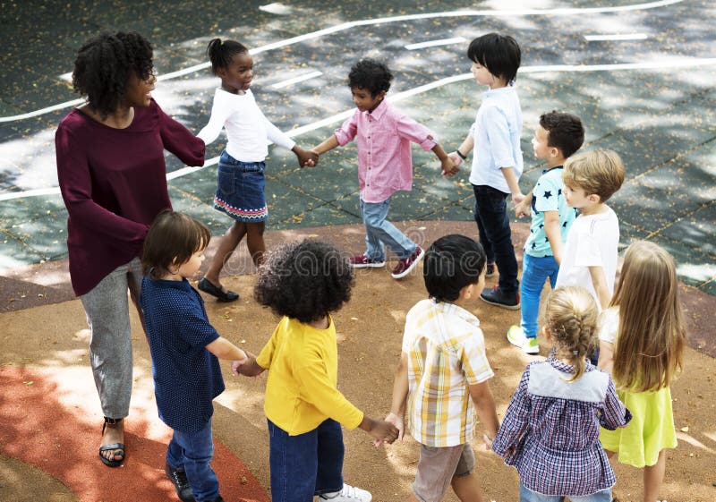 Kindergarten Students Standing Holding Hands in Circle Form Stock Image ...