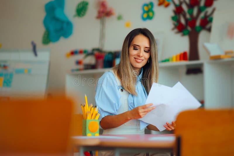 Kindergarten Teacher Gathering Activity Sheets in the Classroom Stock ...