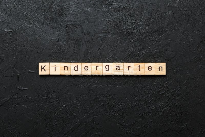 Kindergarten Word Written on Wood Block. Kindergarten Text on Table ...