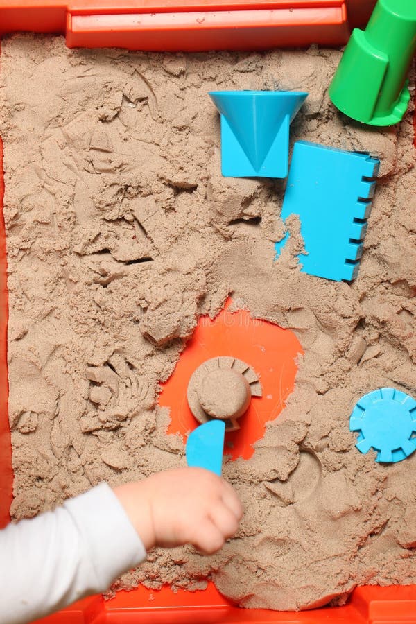 Kinetic sand play baby stock image. Image of child, childhood - 65122887