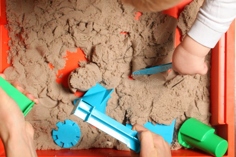 Kinetic sand play baby stock image. Image of child, childhood - 65122887