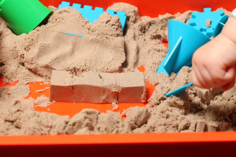 Kinetic sand play baby stock photo. Image of play, hand - 65123442