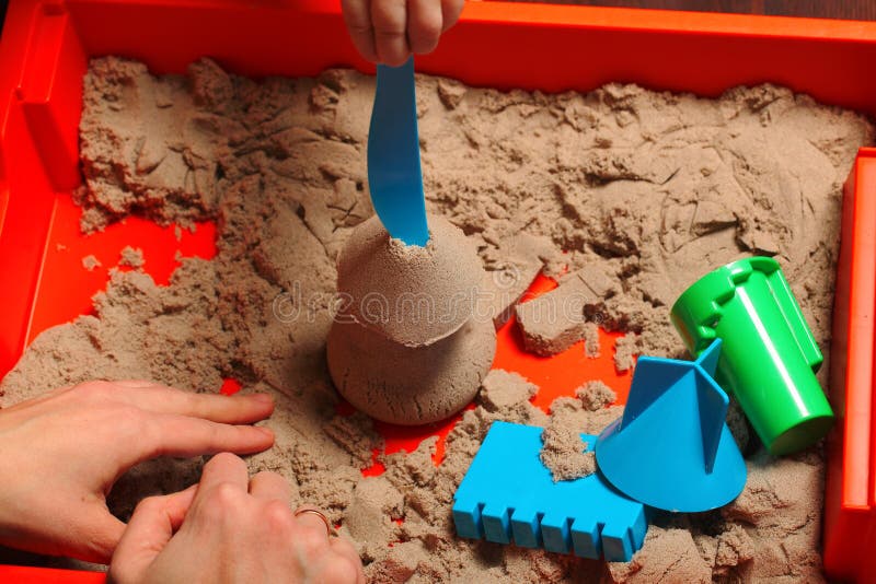 Kinetic sand play baby stock image. Image of bucket, hand - 65123739