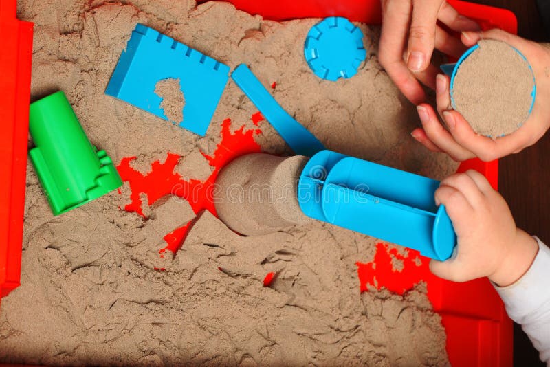 Kinetic sand play baby stock image. Image of bucket, hand - 65123739