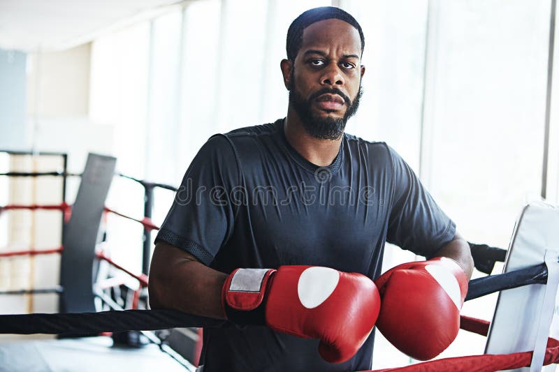 The King of the Boxing Ring. Portrait of a Man Training in a Boxing ...