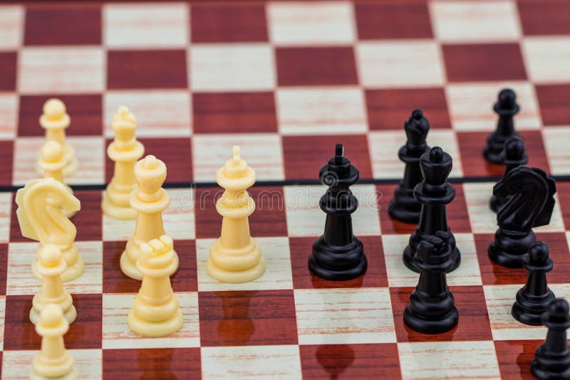 King Chess Piece with Chess Figures Standing on White Table in a Stock ...